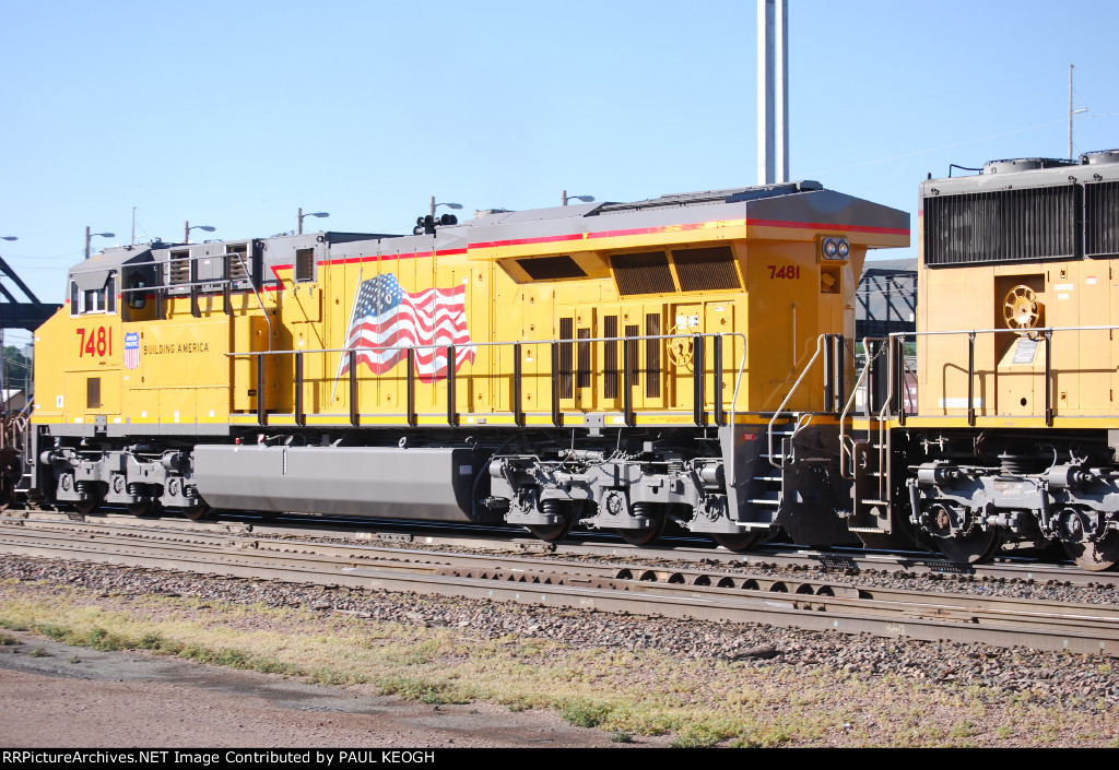 UP 7481 Third Unit behind the Leader UP 7482 pulls westbound and Up the Grade Out of UP Green River.
